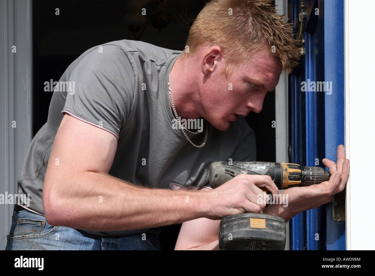 "Tradesman working with a cordless drill Stock Photo - Alamy
