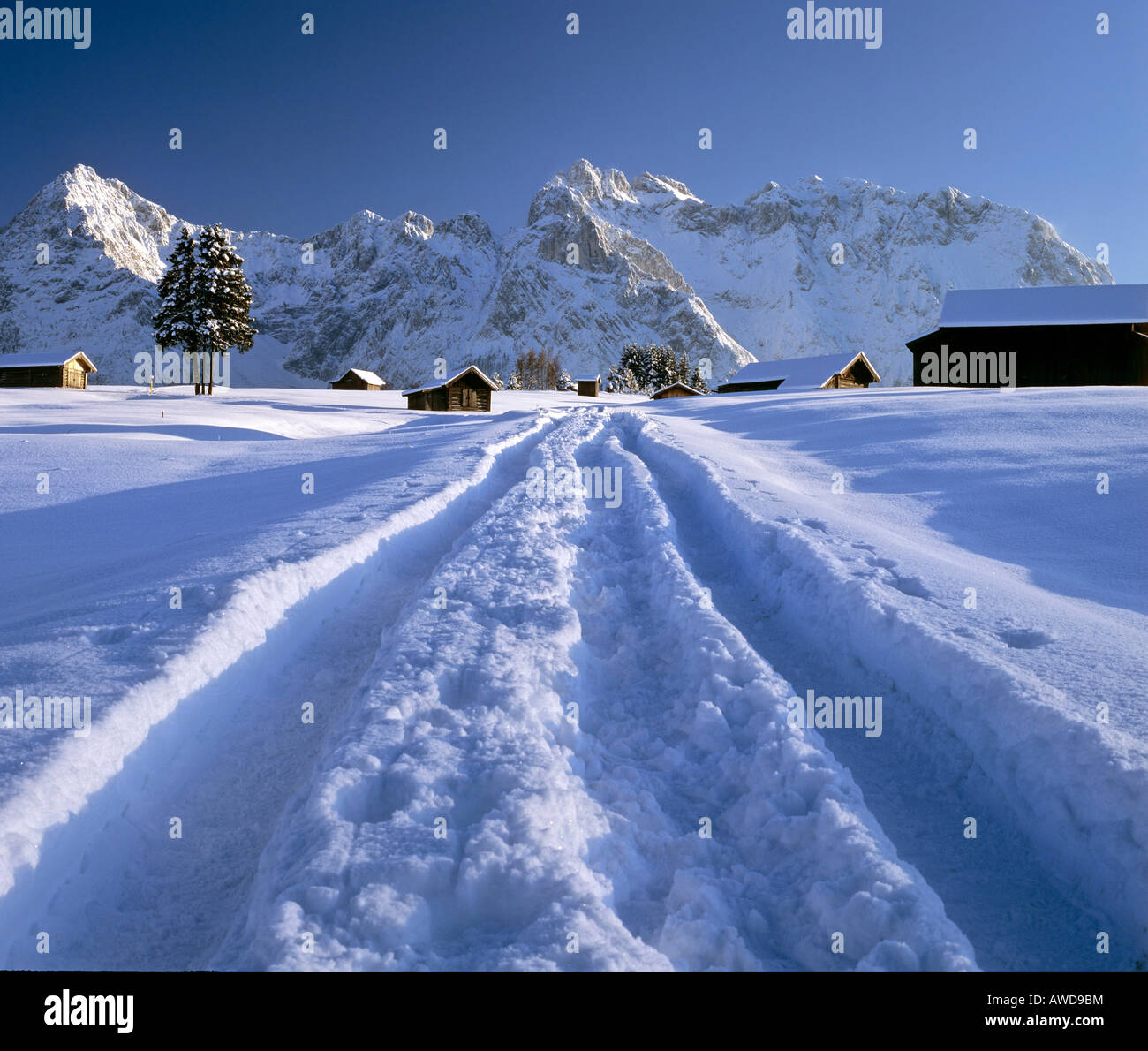 Snowy dirt track in winter, Karwendel mountains, Mittenwald, Upper ...