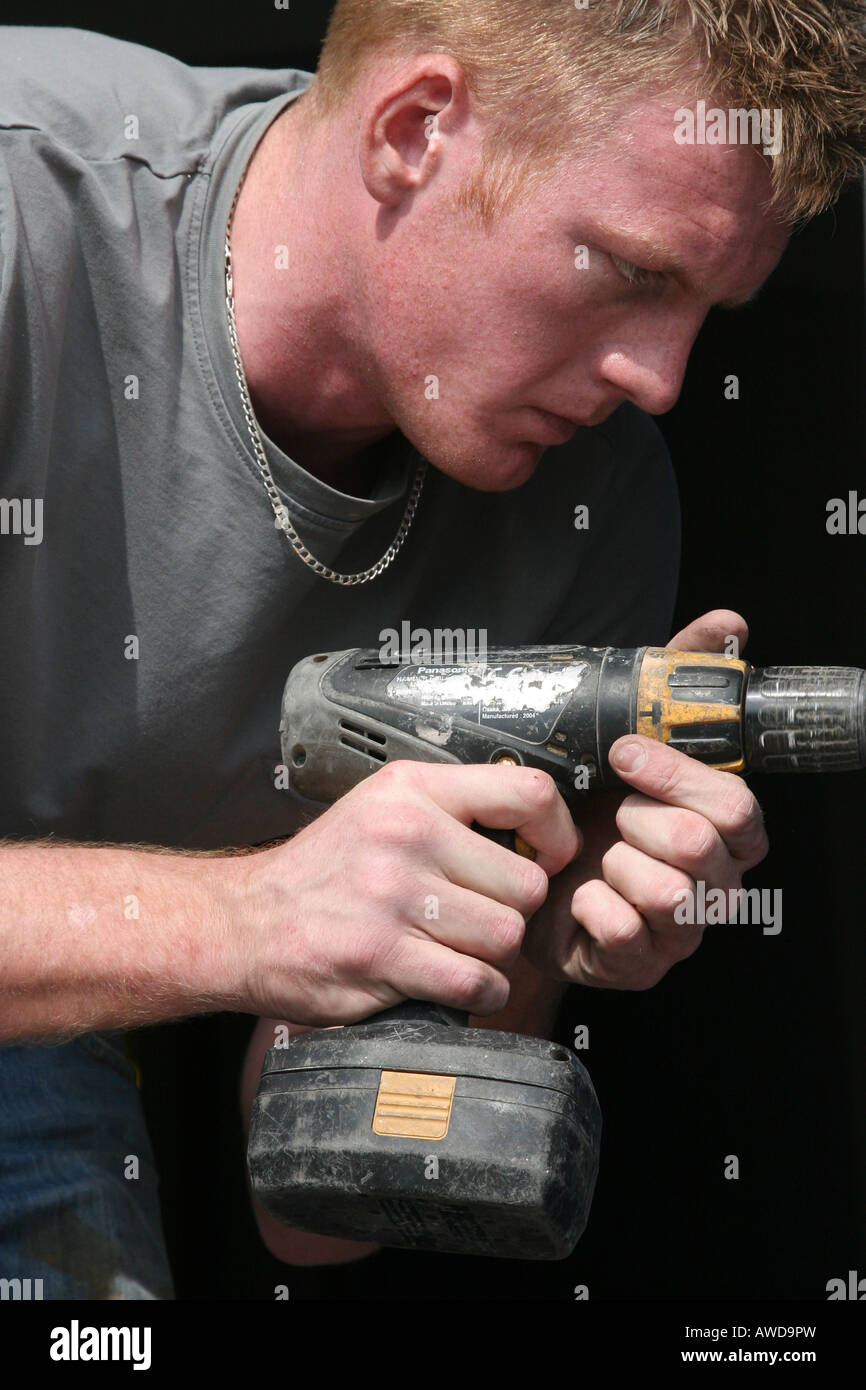 "Tradesman working with a cordless drill Stock Photo - Alamy
