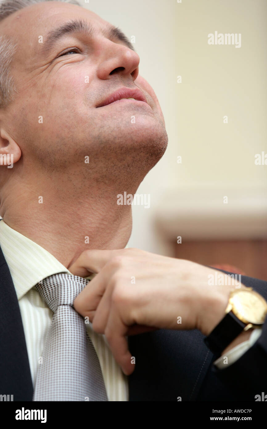 Uncomfortable businessman collar neck hi-res stock photography and ...