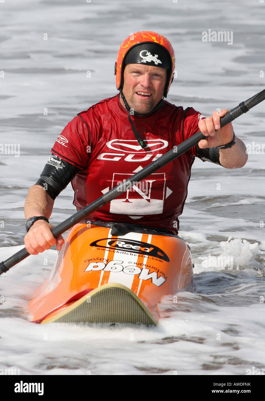 instructor in an orange mega surf kayak in the sea Stock Photo - Alamy