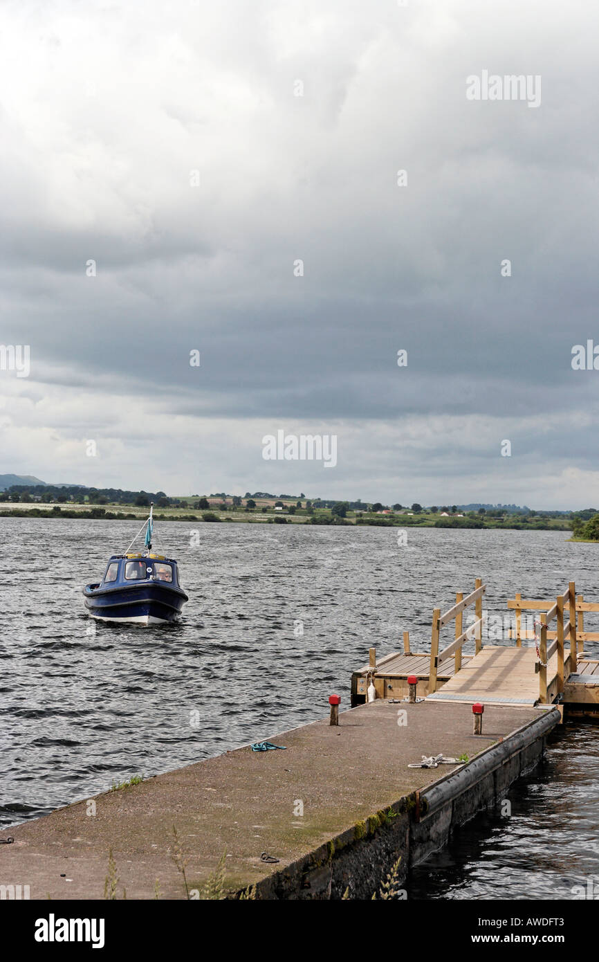 A Ferry Sailing Towards the Pier at Lochleven Castle in Scotland Stock ...