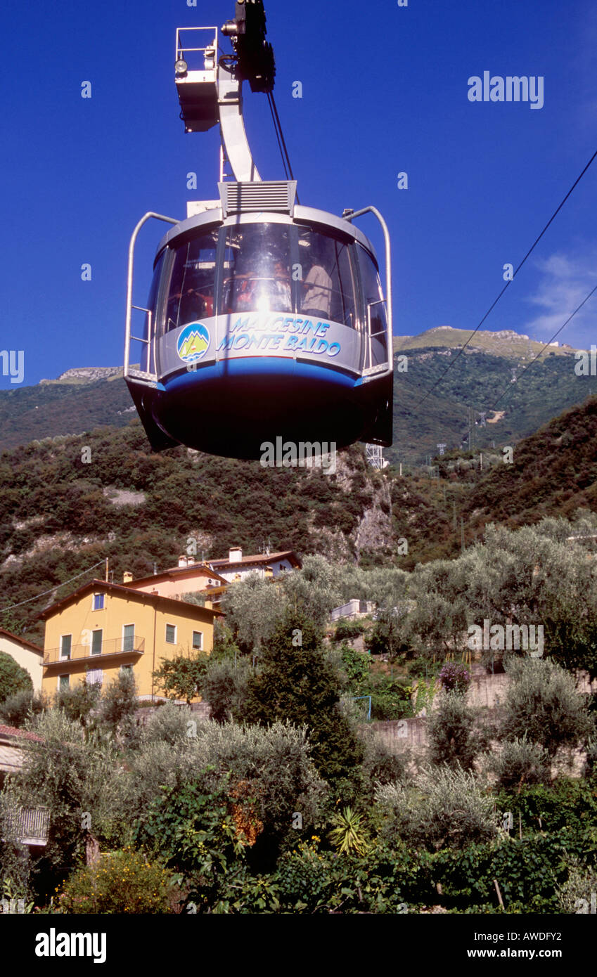Cable car heading for the summit of Monte Baldo above the lakeside ...