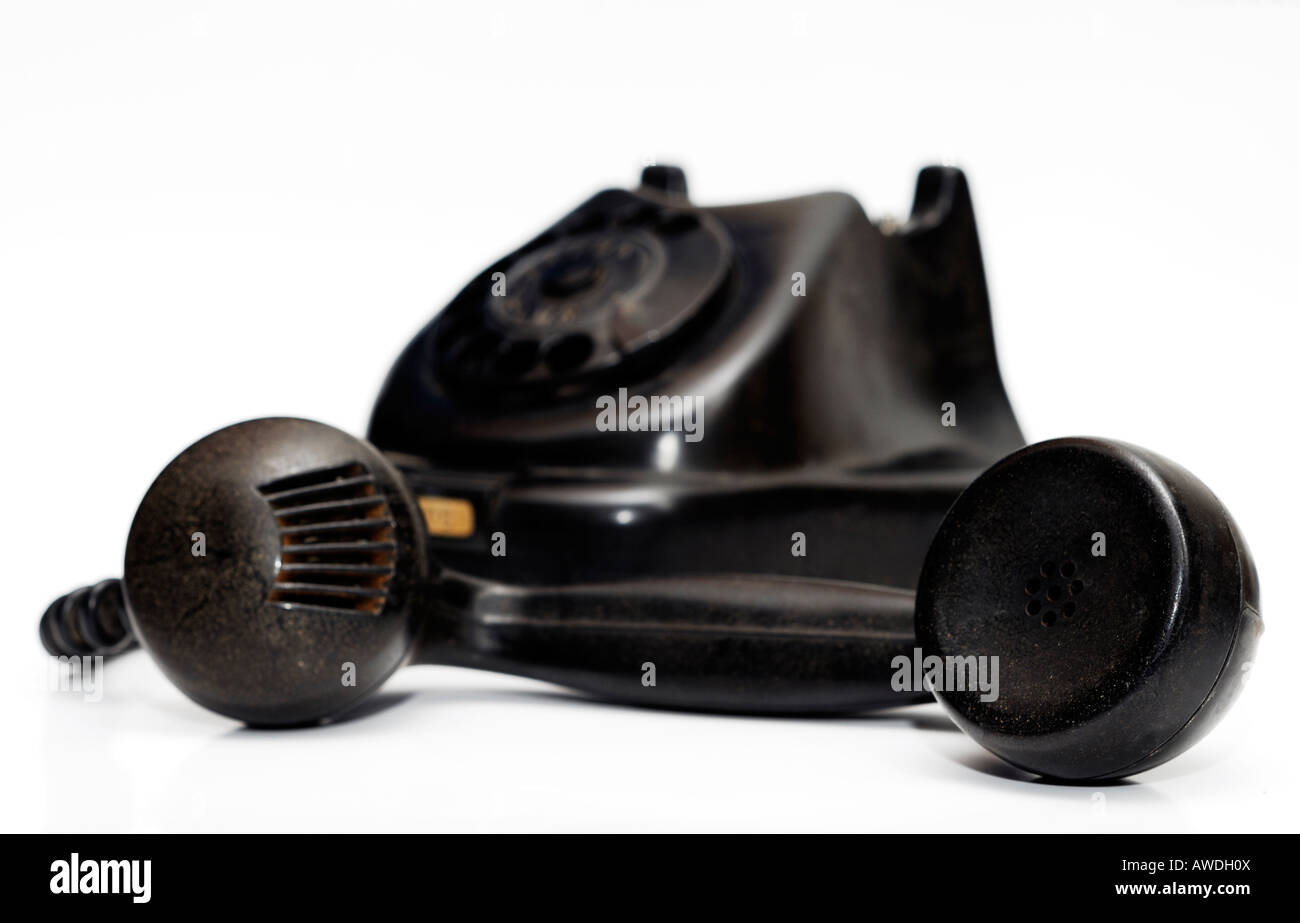 black old vintage phone with hand set off hooks dial showing number and ...
