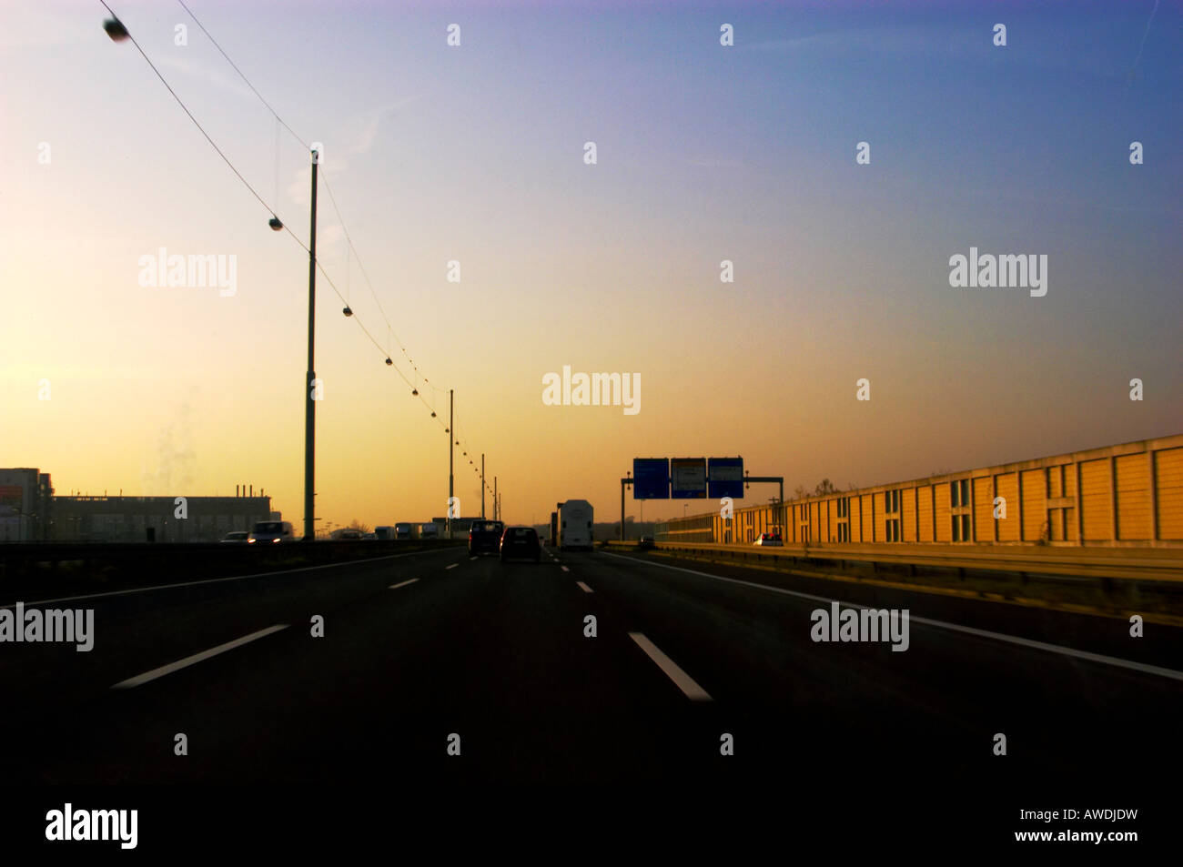 Motorway at sunset Stock Photo - Alamy
