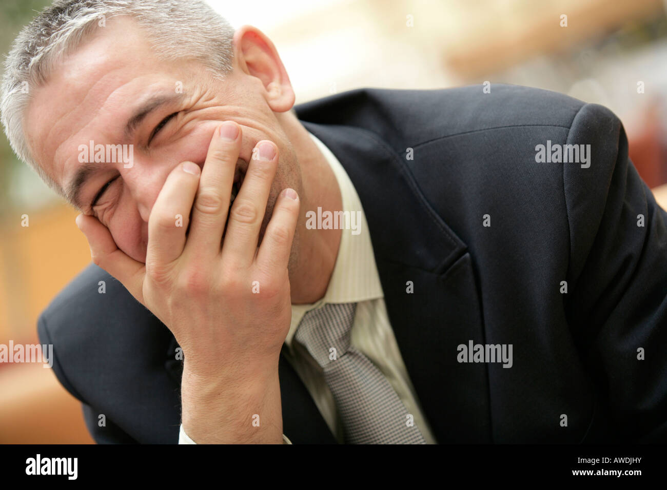Covering mouth laughing hi-res stock photography and images - Alamy