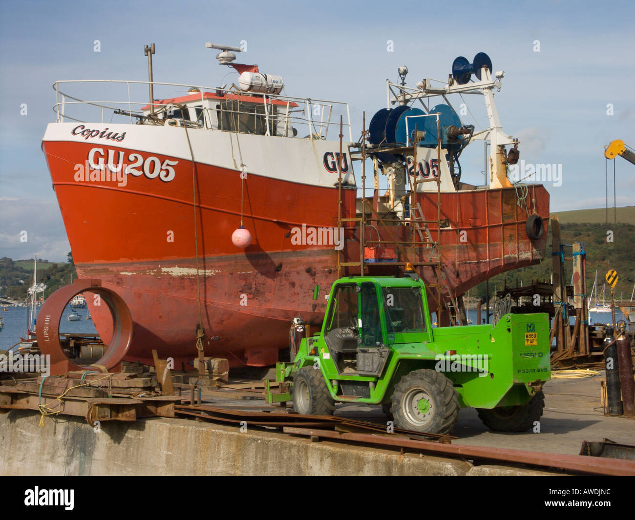 Working on a fishing boat in a Cornish boatyard Stock Photo - Alamy