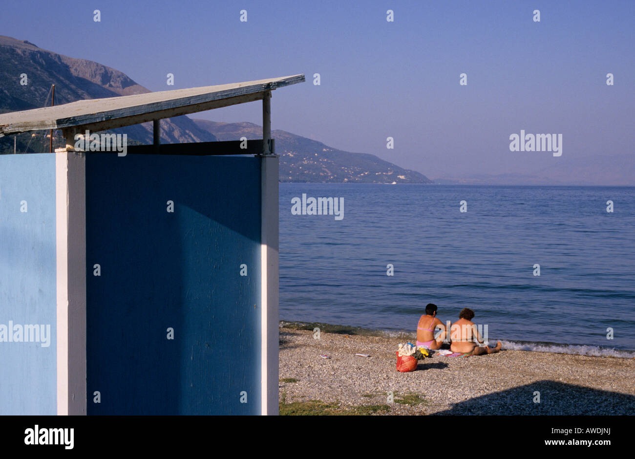 a view on the beach of Ipsos a touristic resort in Corfu Island Greece ...