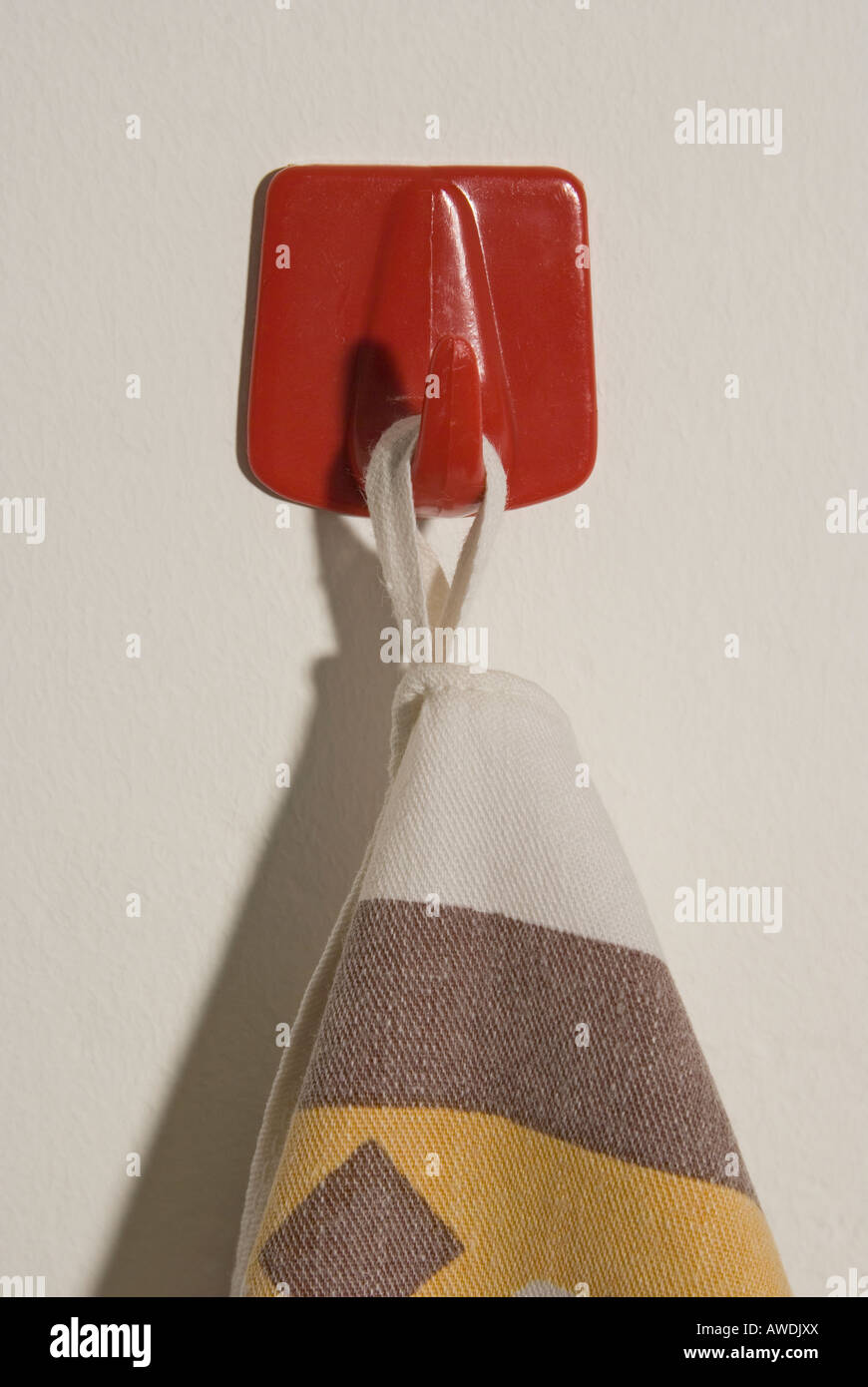 dish cloth on plastic hook fixed at wall Stock Photo - Alamy