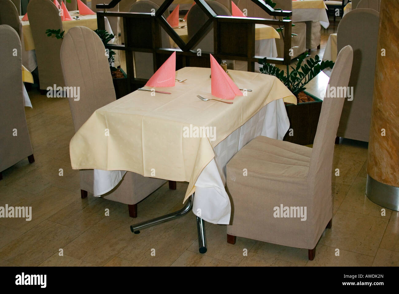 Tables setup for dinner in a hotel Stock Photo - Alamy
