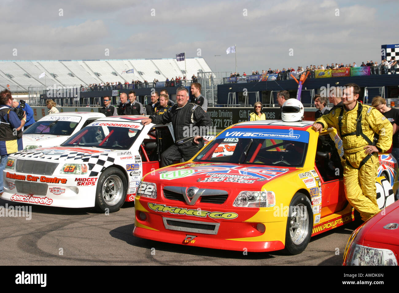 Racing pick up trucks lined up with drivers by trucks Stock Photo - Alamy