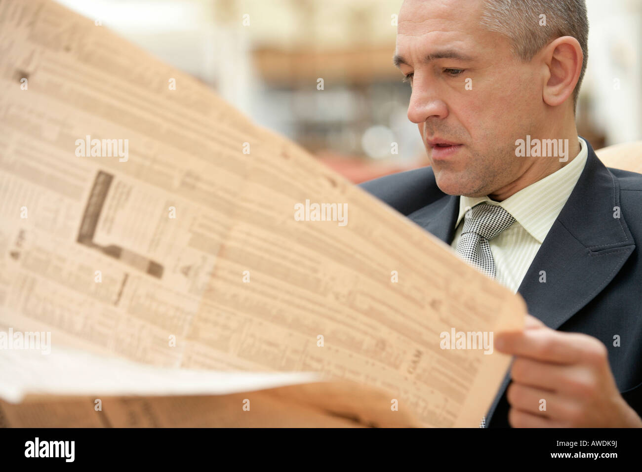 Newspaper hold man suit sit hi-res stock photography and images - Alamy