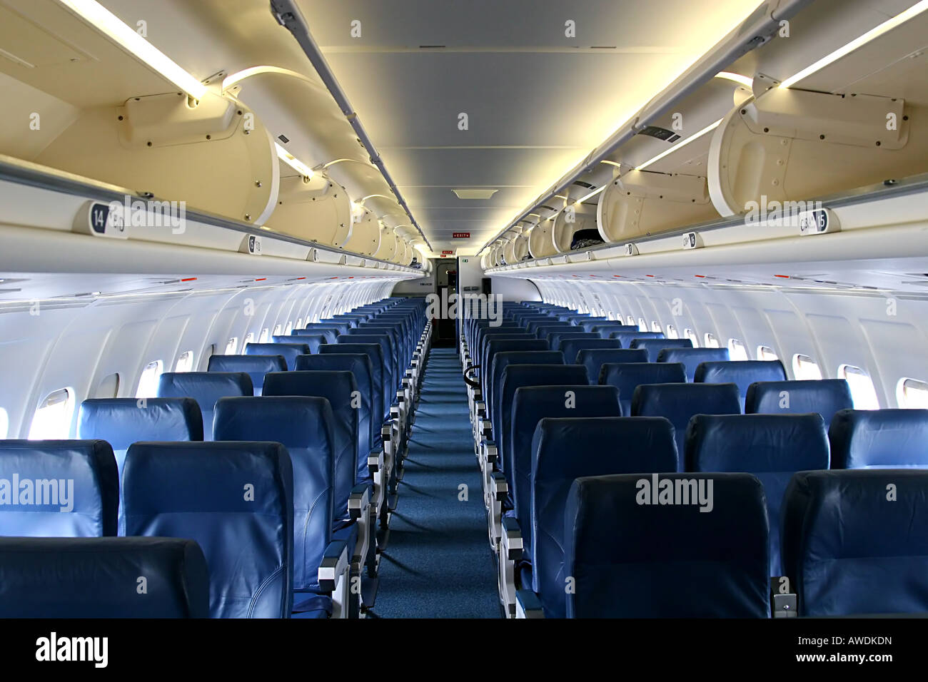 Shot down center aisle of an empty passenger jet Stock Photo - Alamy