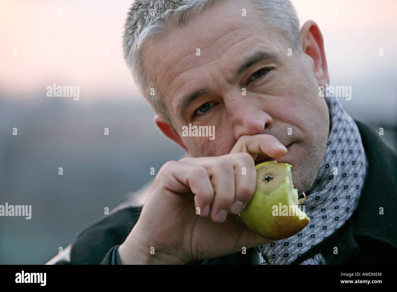 Man with apple Stock Photo - Alamy