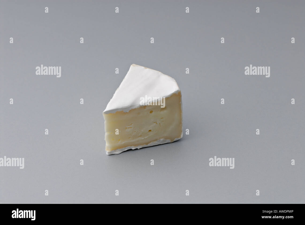 Soft cheese slice Stock Photo - Alamy