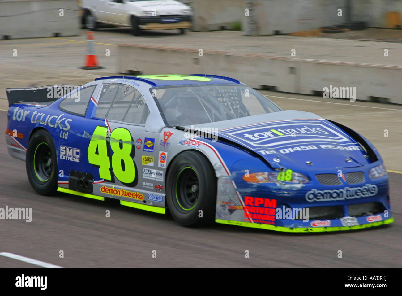 V8 stock car coming into the pits after being involved in a crash Stock ...