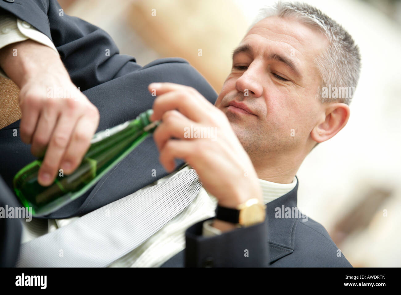 Busienssman with bottle of mineral water Stock Photo - Alamy