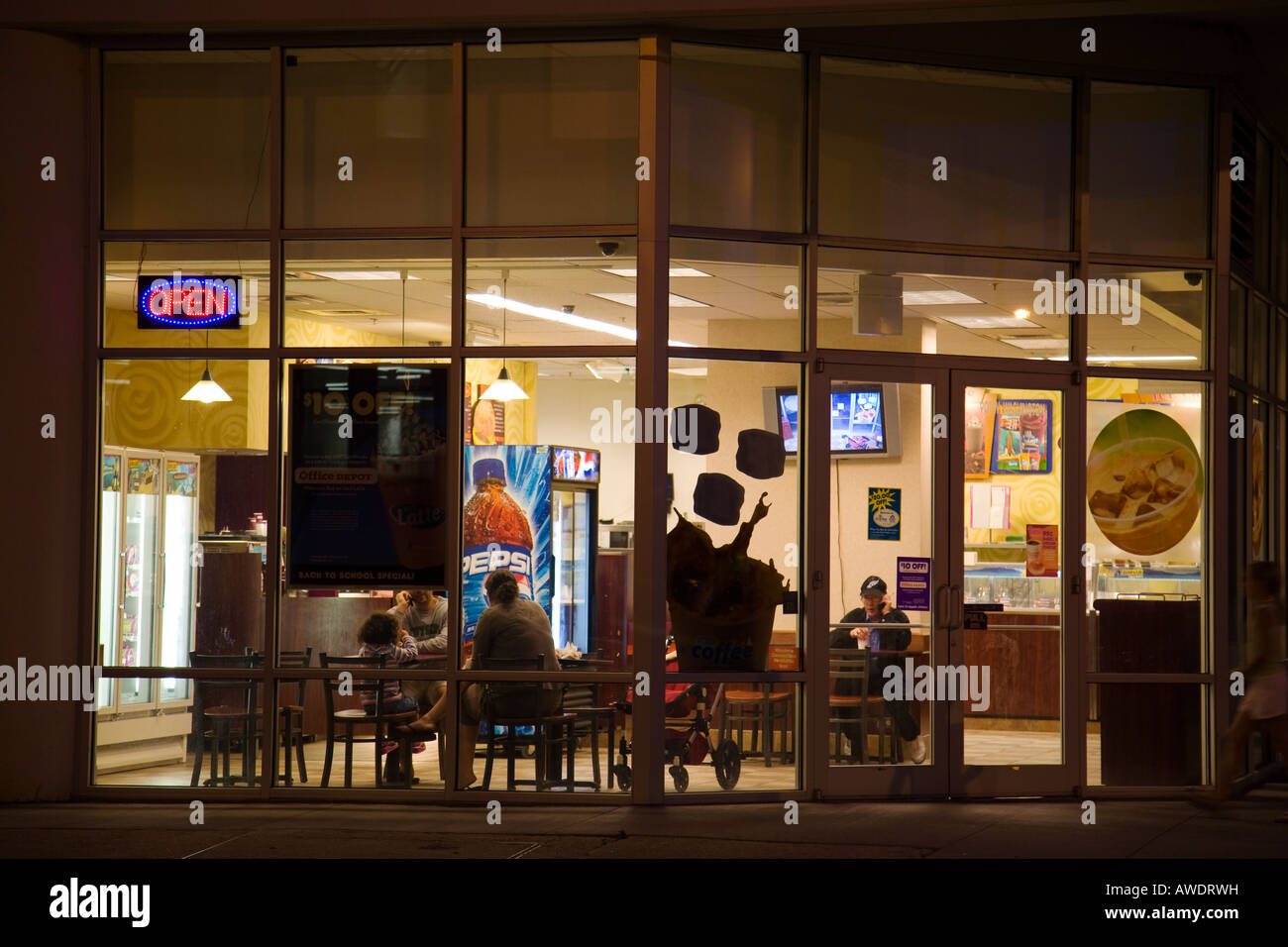 ILLINOIS Chicago Customers inside quick shop store at night neon sign ...