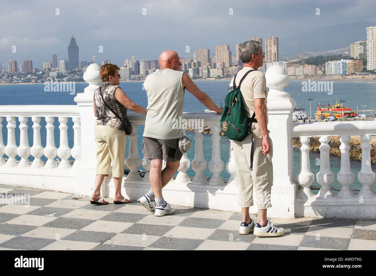 Group of people in bright sun taking in the view at Benidorm on the ...