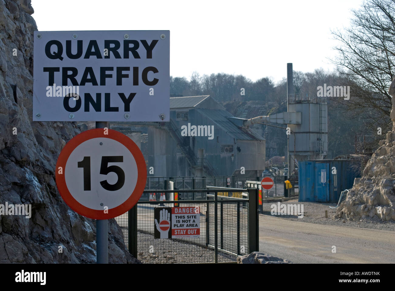 warning signs at entrance to quarry Stock Photo - Alamy