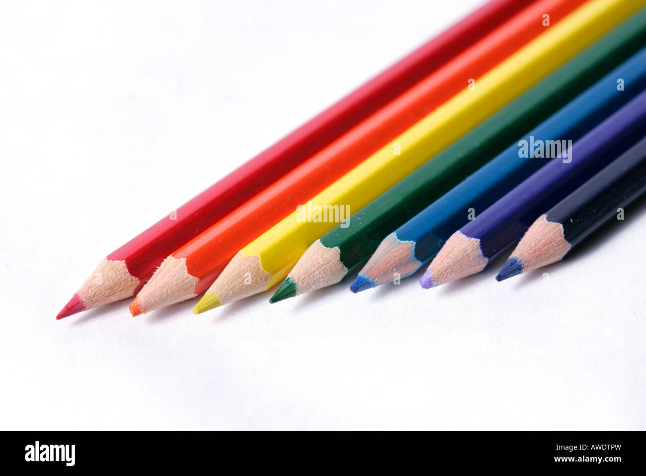 Seven pencil crayons arranged in a row Stock Photo - Alamy