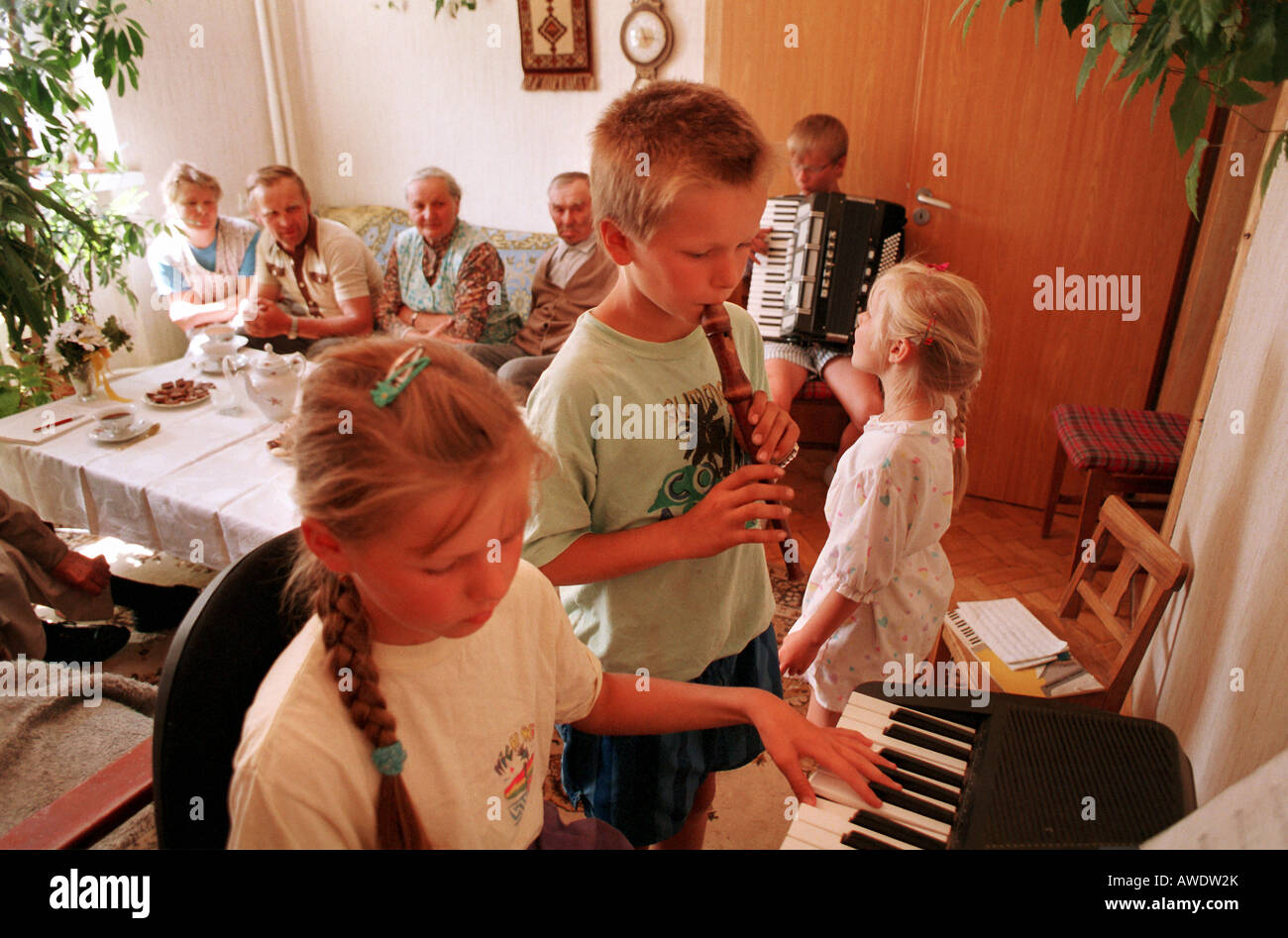 Children during a family music performance, Kotulin, Poland Stock Photo ...