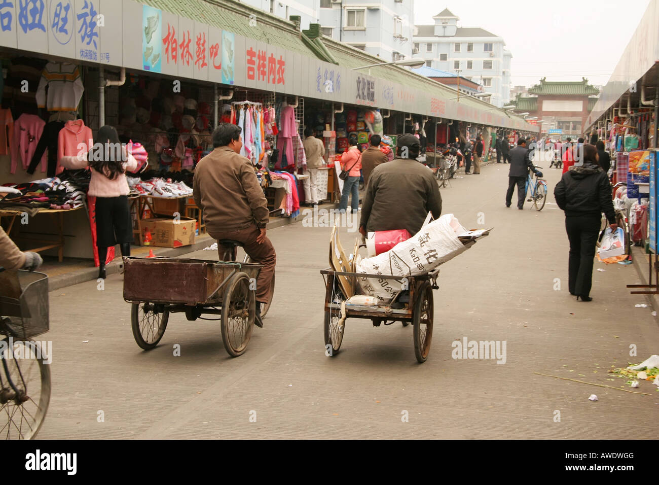 Street side shops in Shanghai China Three wheel bicycles Stock Photo ...