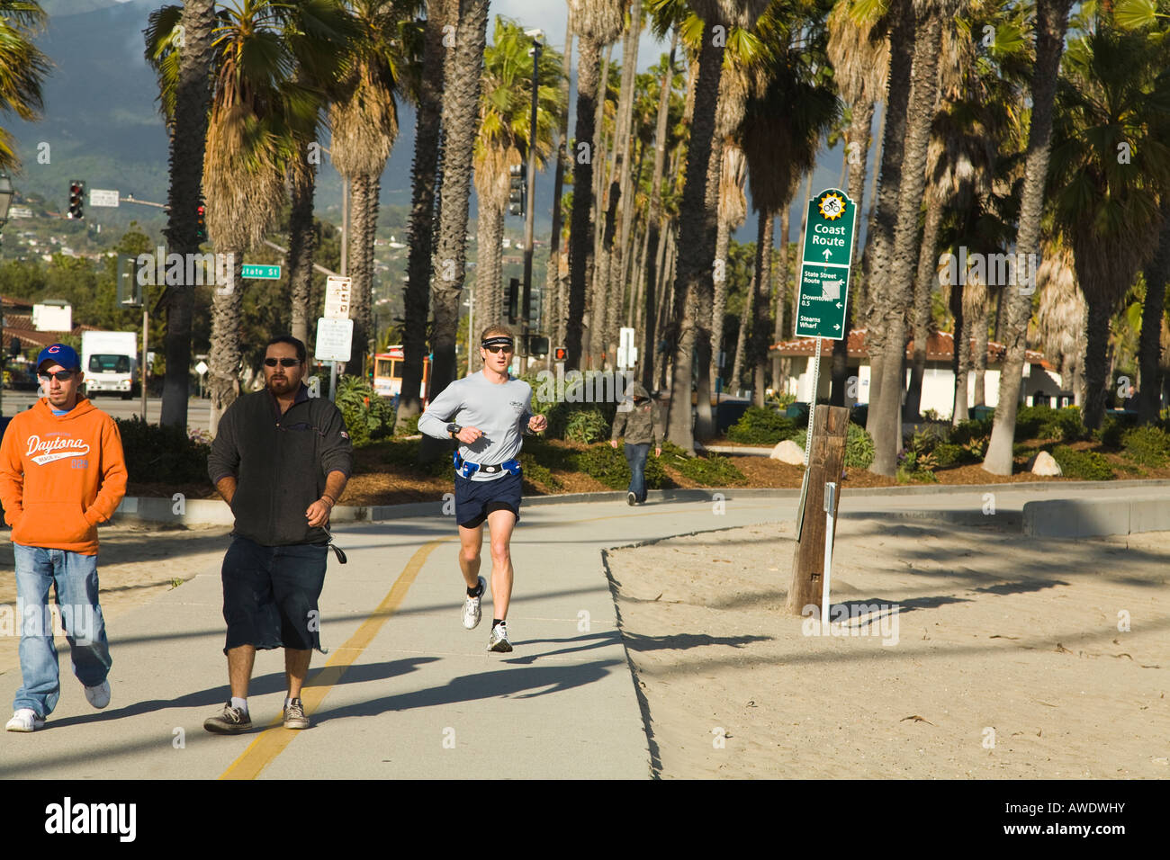 CALIFORNIA Santa Barbara People walking and running along paved path ...