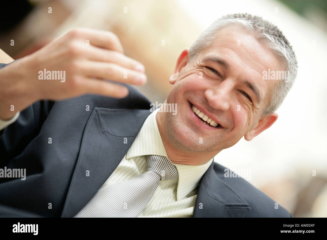 Portrait of smiling businessman Stock Photo - Alamy