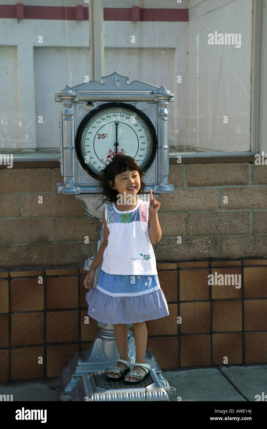 Girl standing on commercial weigh scale Ventura, Harbor, California ...