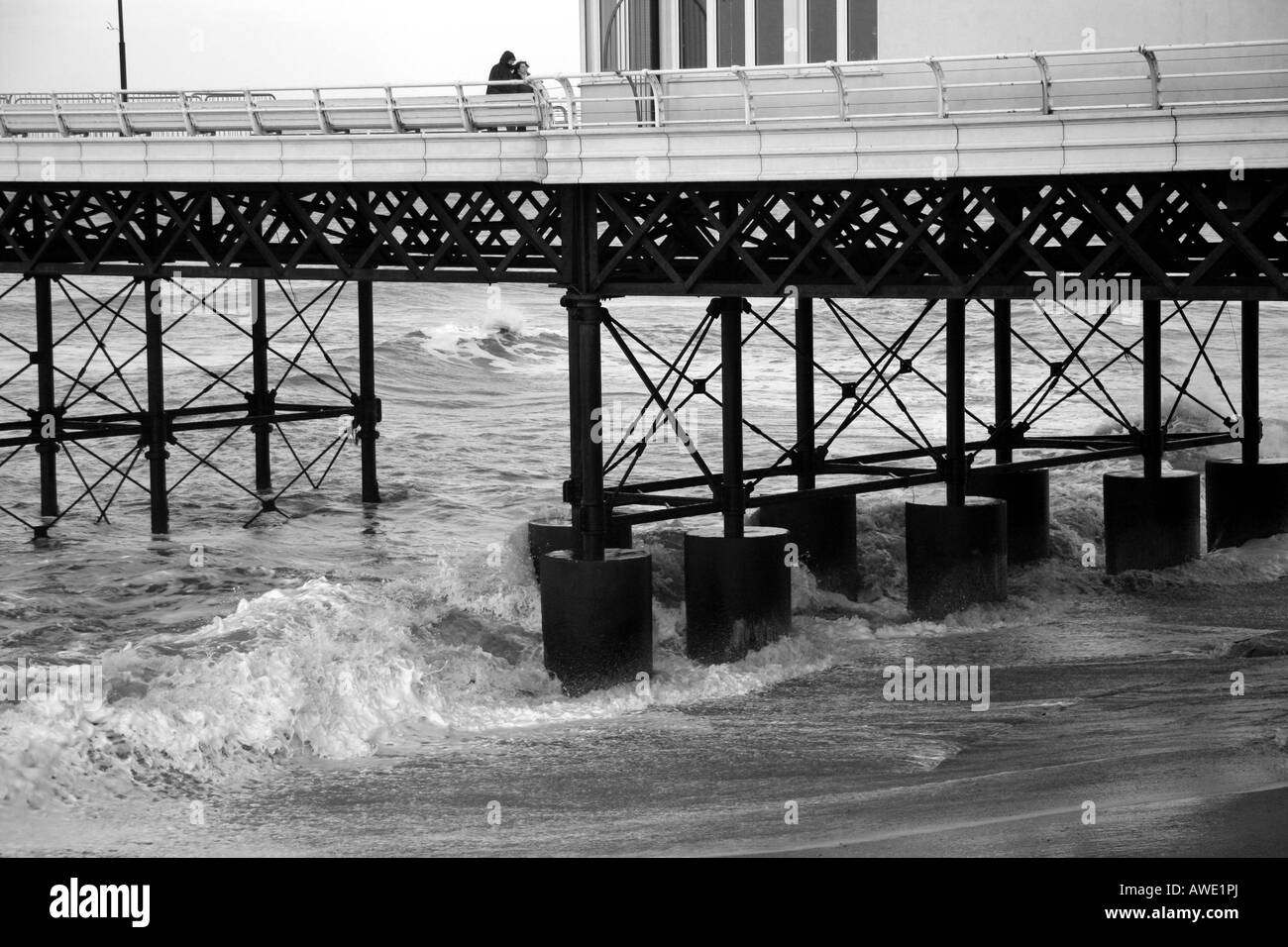 Side view of Cromer pier with waves crashing underneath Stock Photo - Alamy