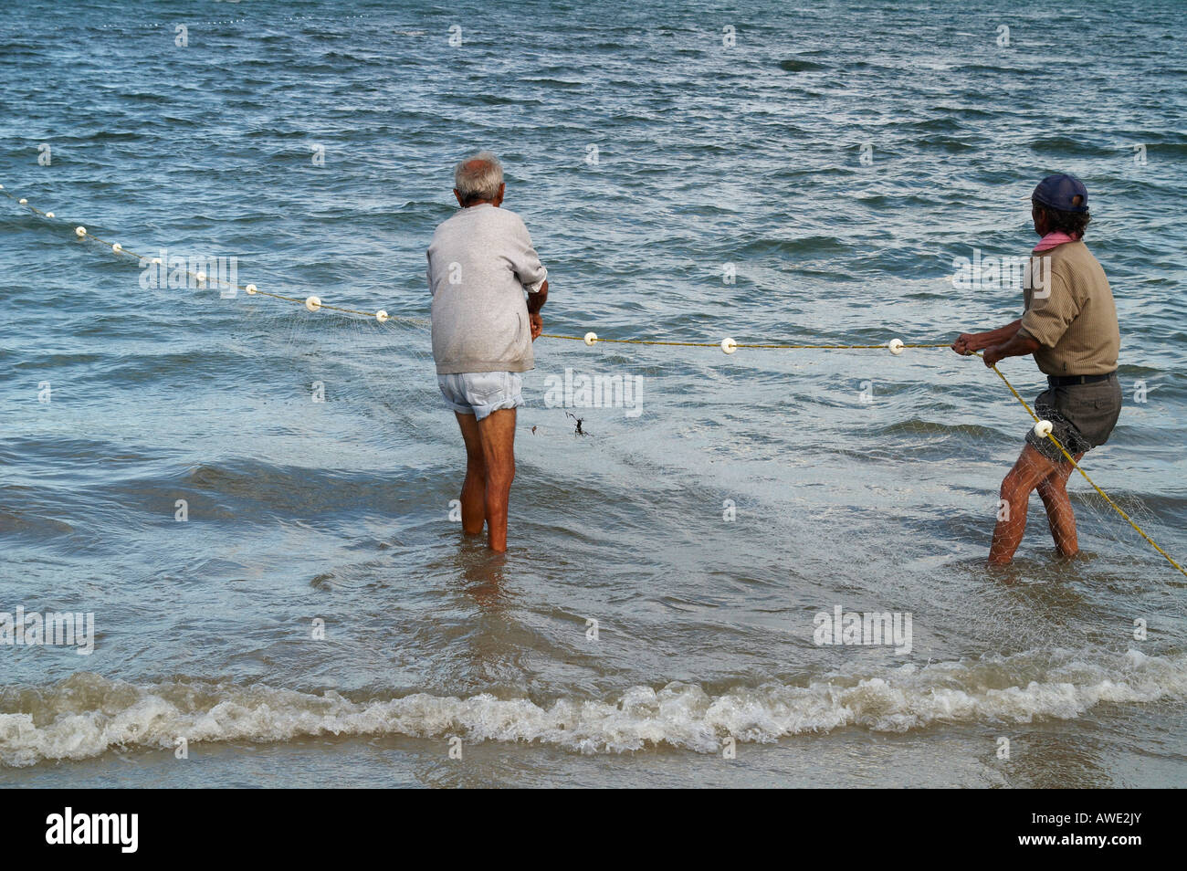 Pulling the net Stock Photo - Alamy