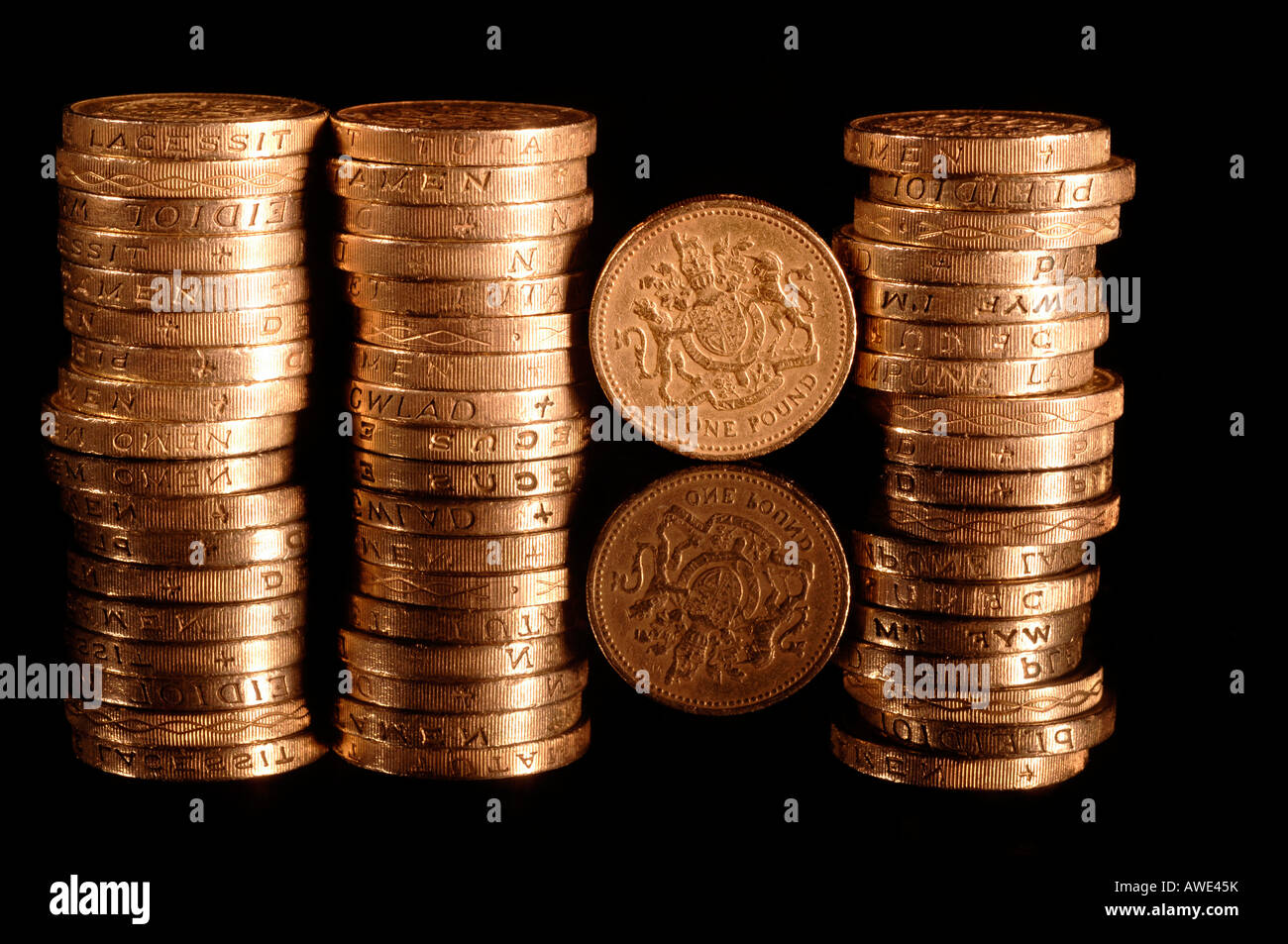 generic of shiny british pound coins balancing in the recession Stock ...