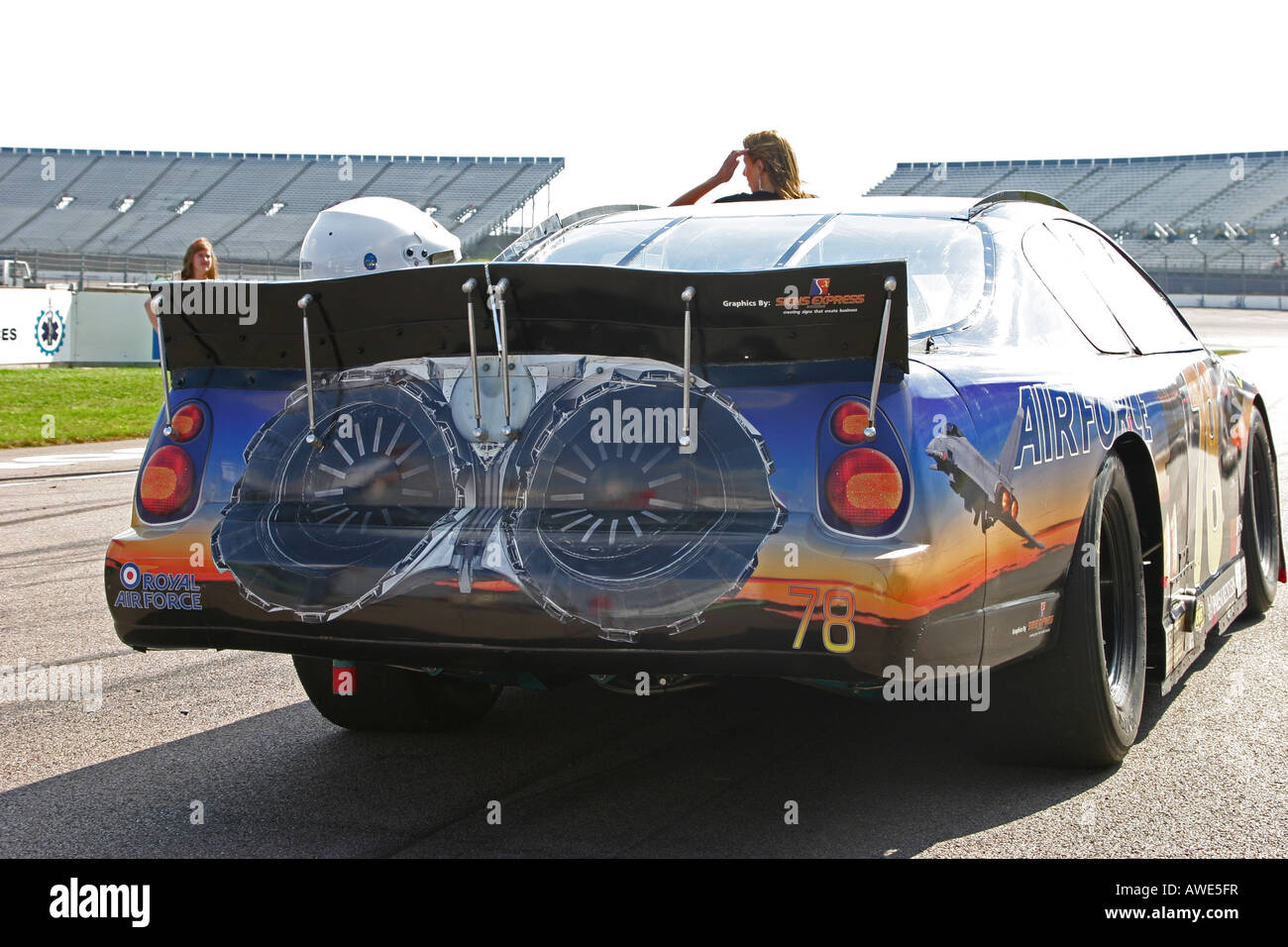 Rear view of V8 stock car showing a picture of jet afterburners Stock ...