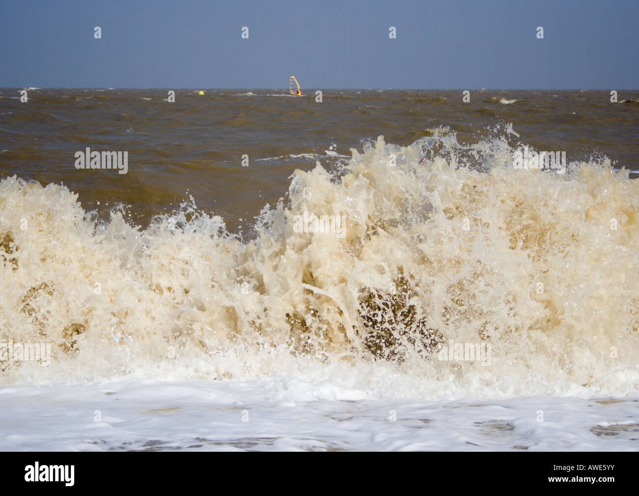 A wave crashes on Whitstable beach Stock Photo - Alamy