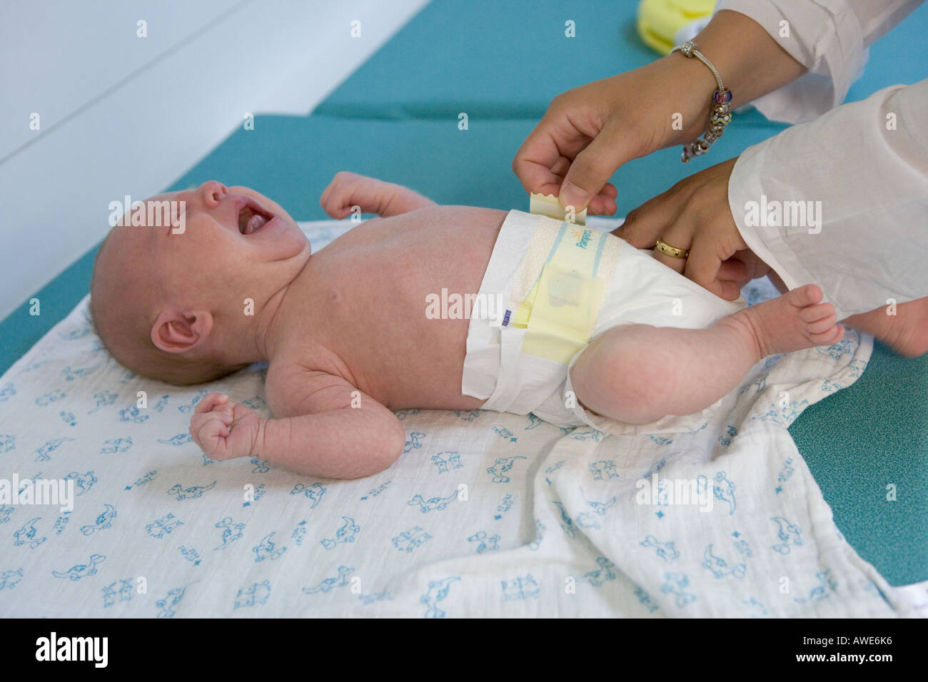 Baby gets a clean diaper Stock Photo - Alamy