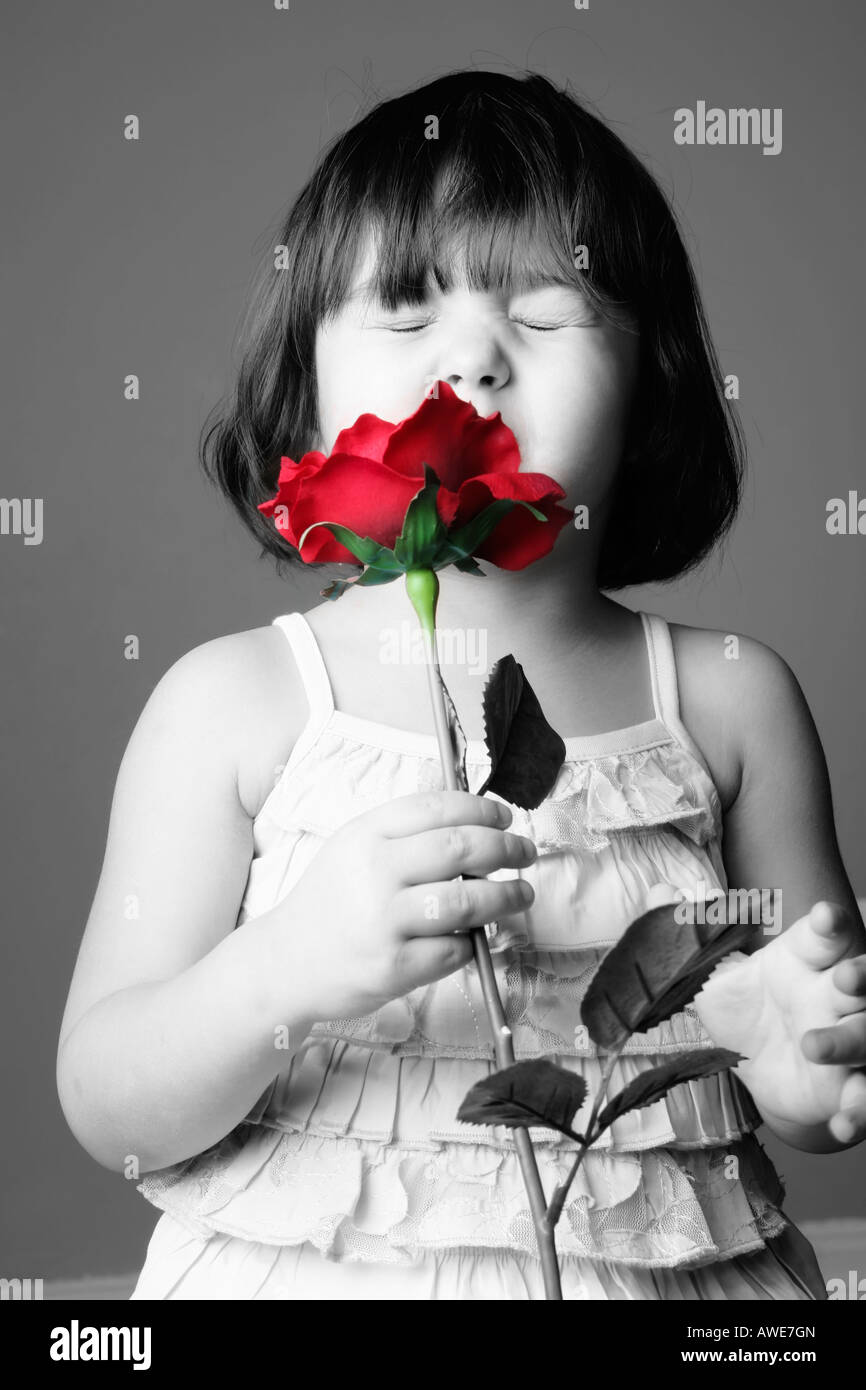 Black child smelling flower hi-res stock photography and images - Alamy
