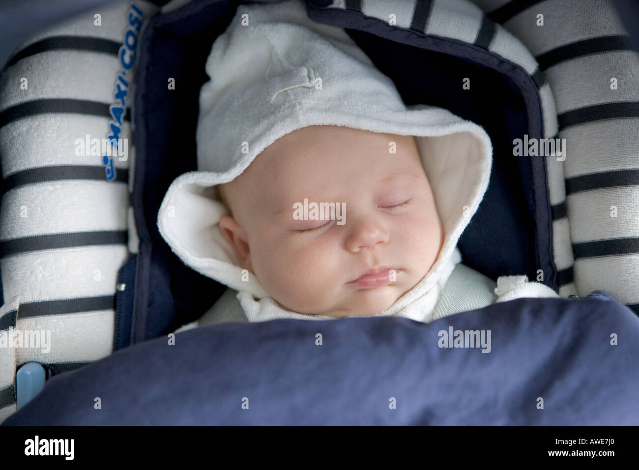Sleeping baby with a hood Stock Photo - Alamy
