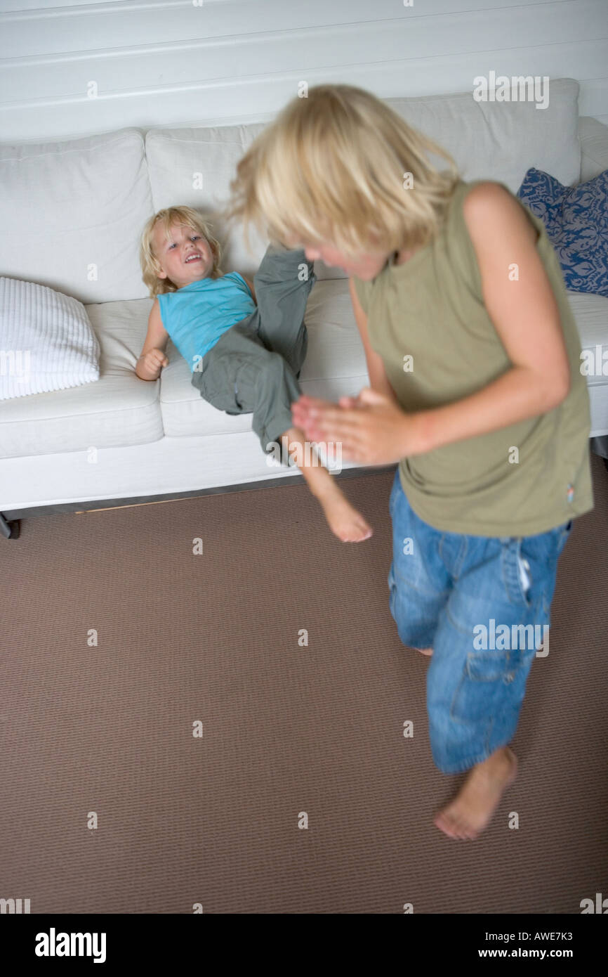 Two boys have a game of romps Stock Photo - Alamy