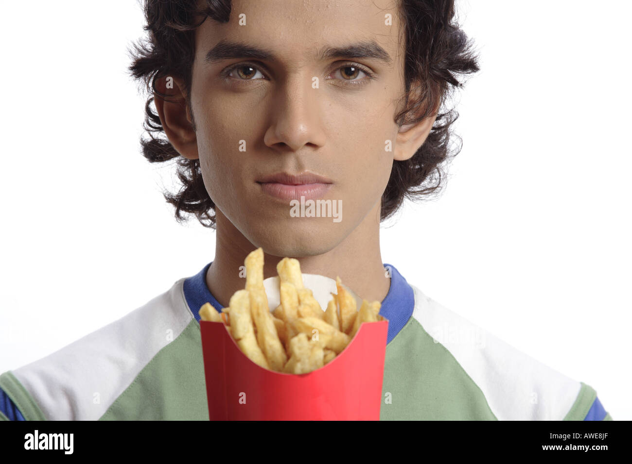 ANG200420 Teenage boy standing packet of potato finger chips French ...