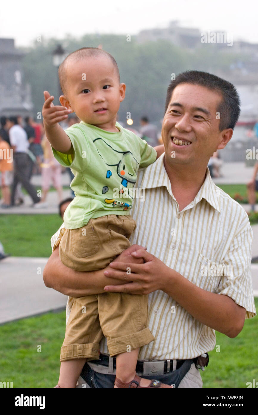 Asia, china, xian, father with little daughter on his arm Stock Photo ...