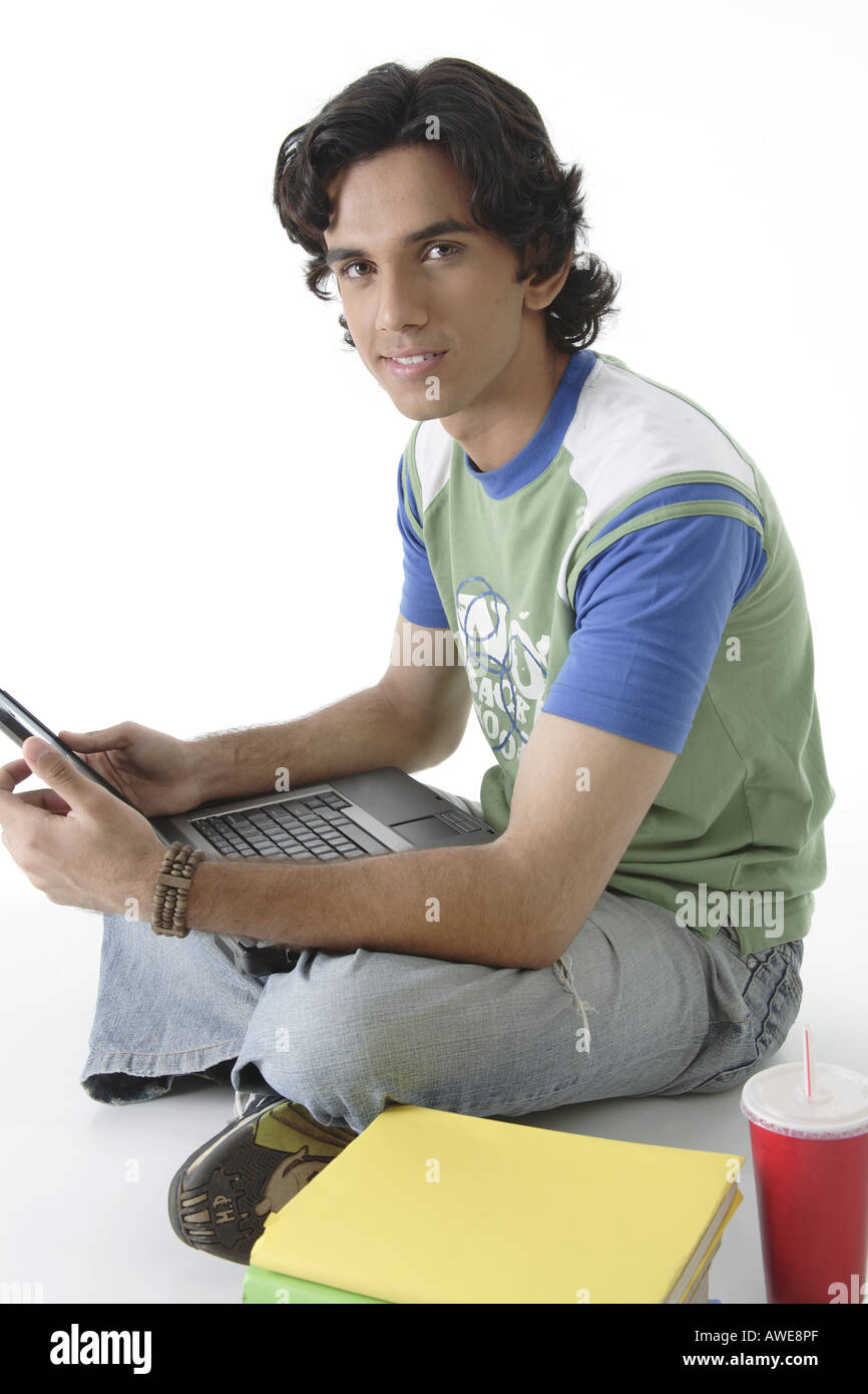 ANG200462 Teenage boy sitting with laptop computer Stock Photo - Alamy