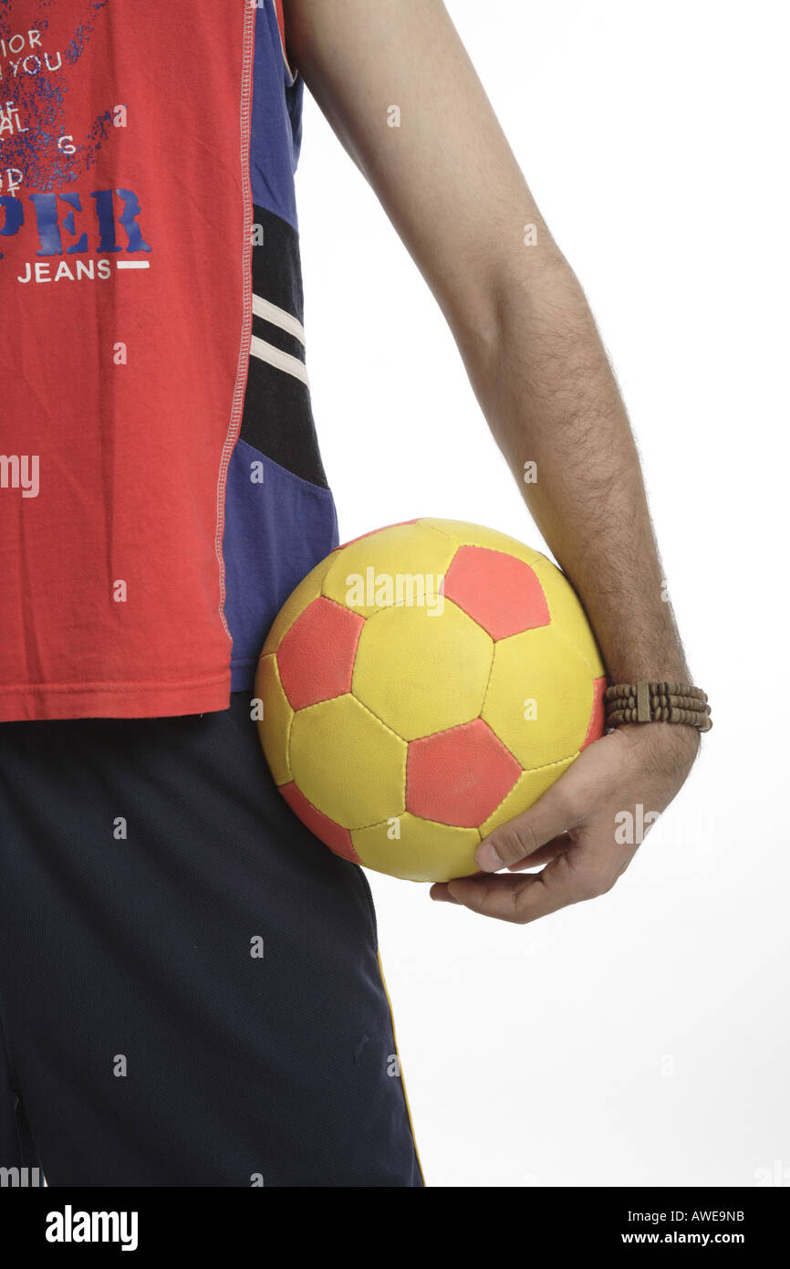 ANG200562 Teenage boy holding football with one hand MR 687T Stock ...