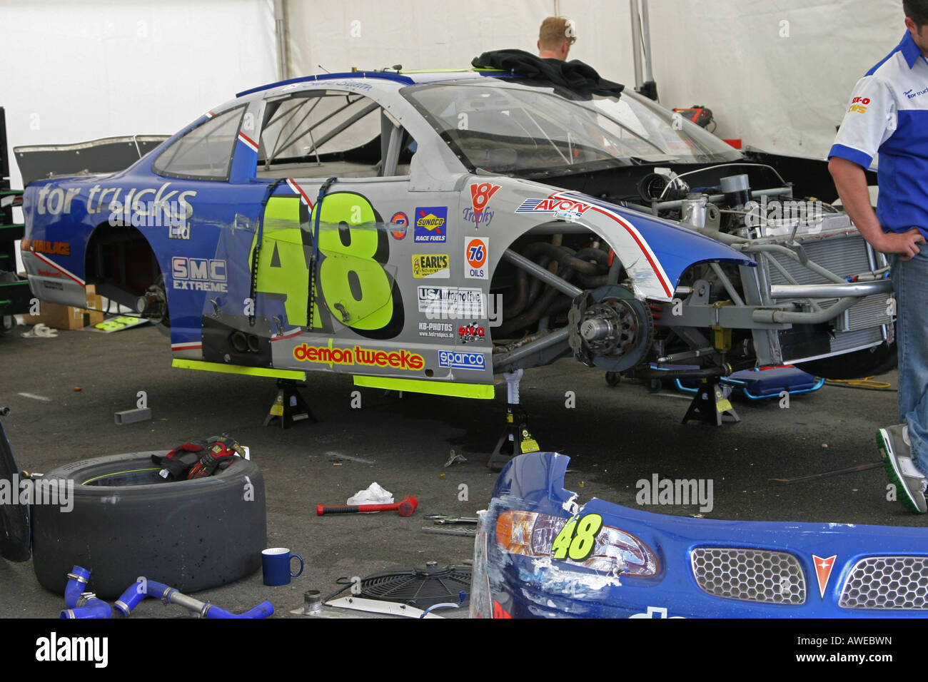 V8 stock car in pieces in the garage after being involved in a crash ...