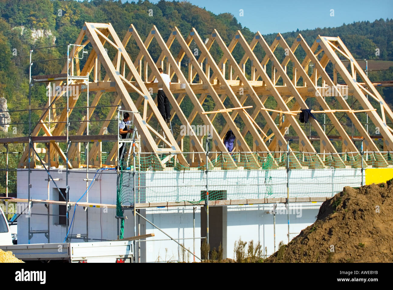 roof truss timbers Construction site brick wall cement gray concrete ...