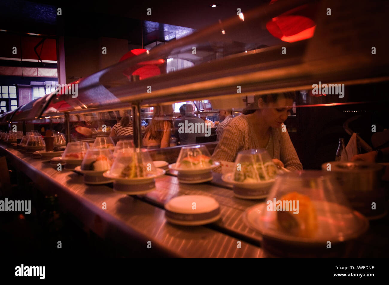 Woman standing behind counter japanese hi-res stock photography and ...