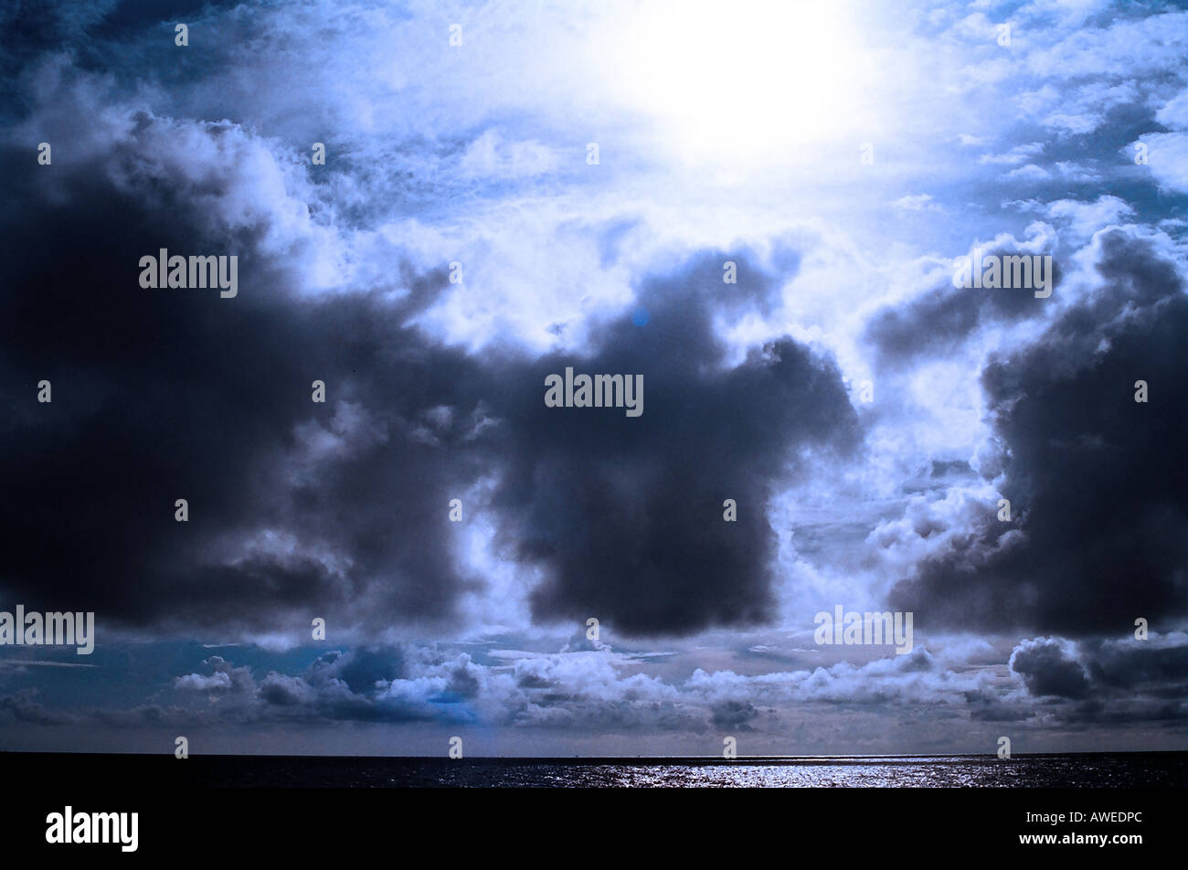 Sun shining through storm clouds, Thailand Stock Photo - Alamy