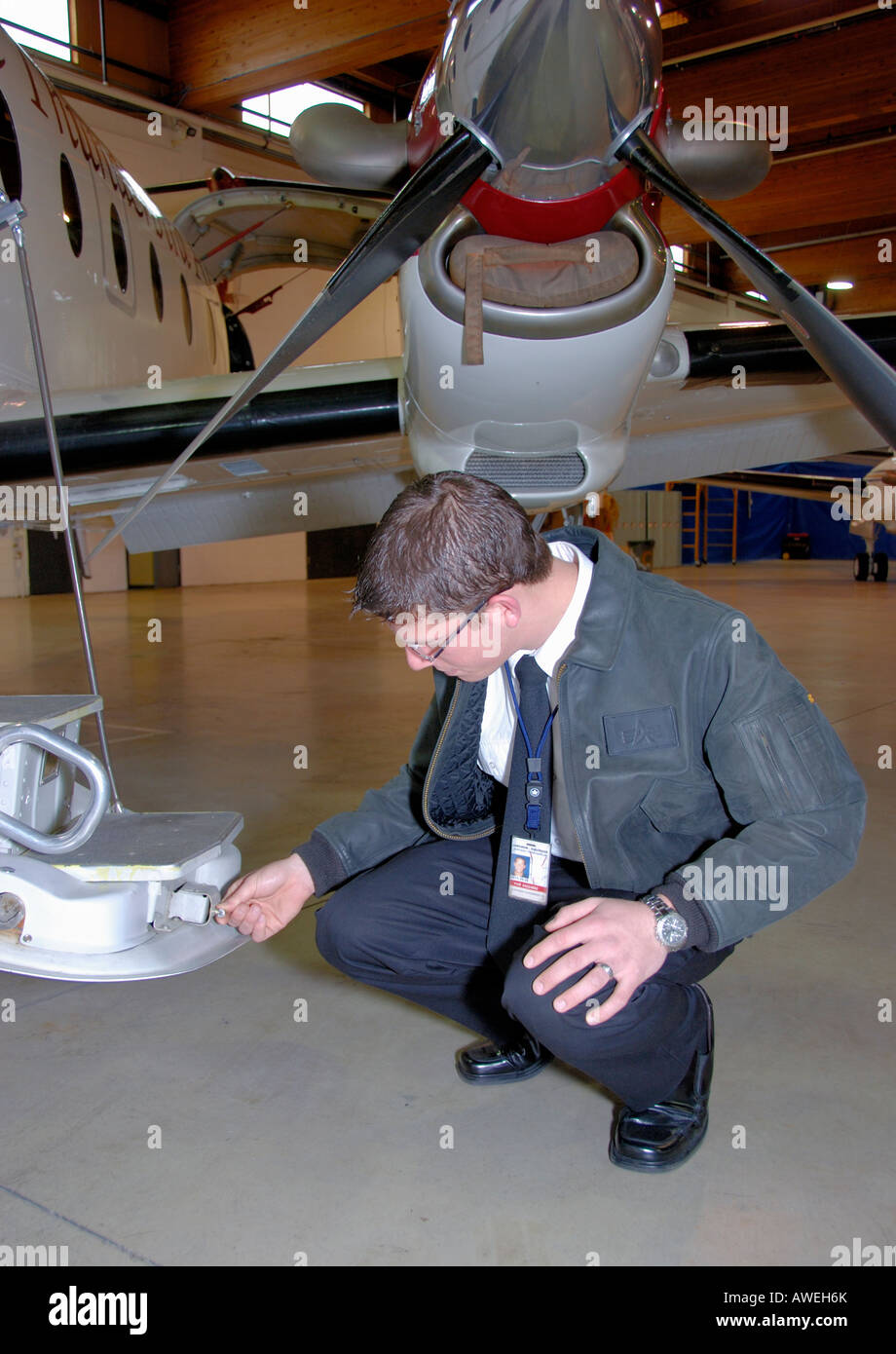 Pilot preflight check,making sure door lock pins are functional Stock ...