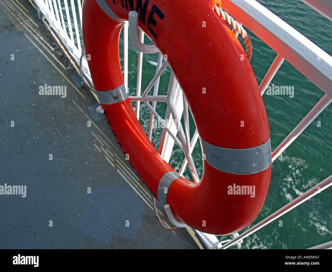 lifebelt at rail of a ship Stock Photo - Alamy