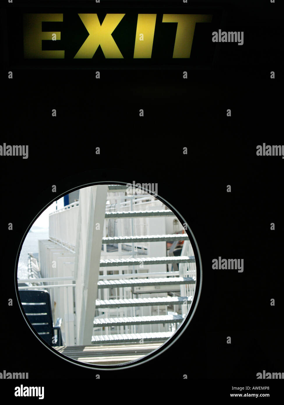 emergency exit view through a round window to sundeck of a ship Stock ...